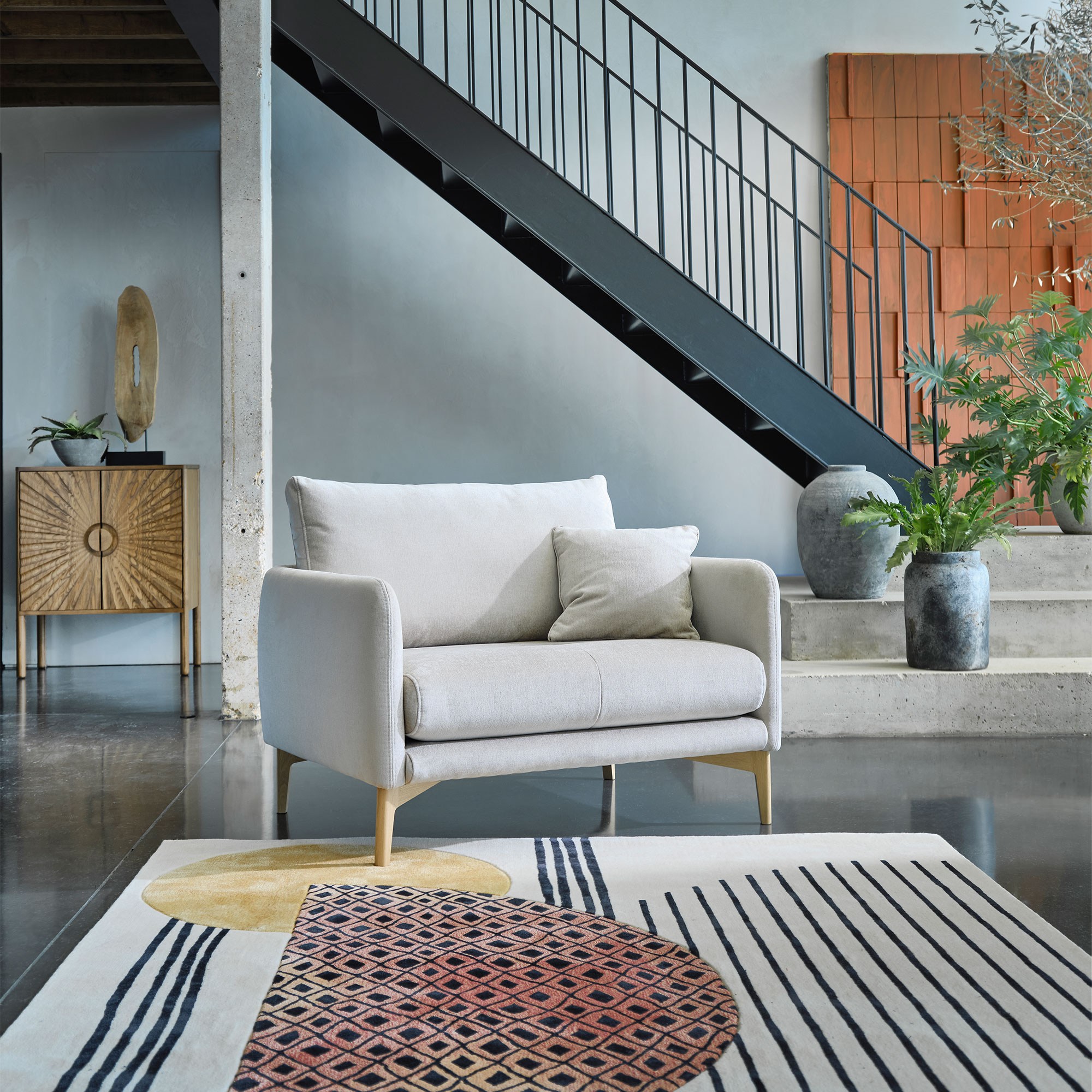 Ercol Aosta Snuggler in Fabric - Haskins Furniture